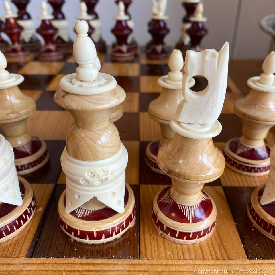 Hand-carved chess set with folding board | Maxsold