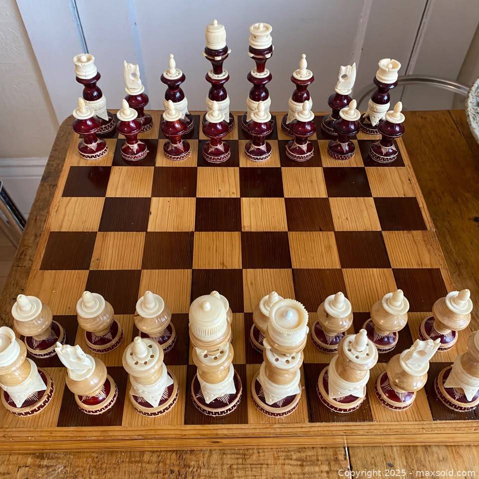 Hand-carved chess set with folding board | Maxsold