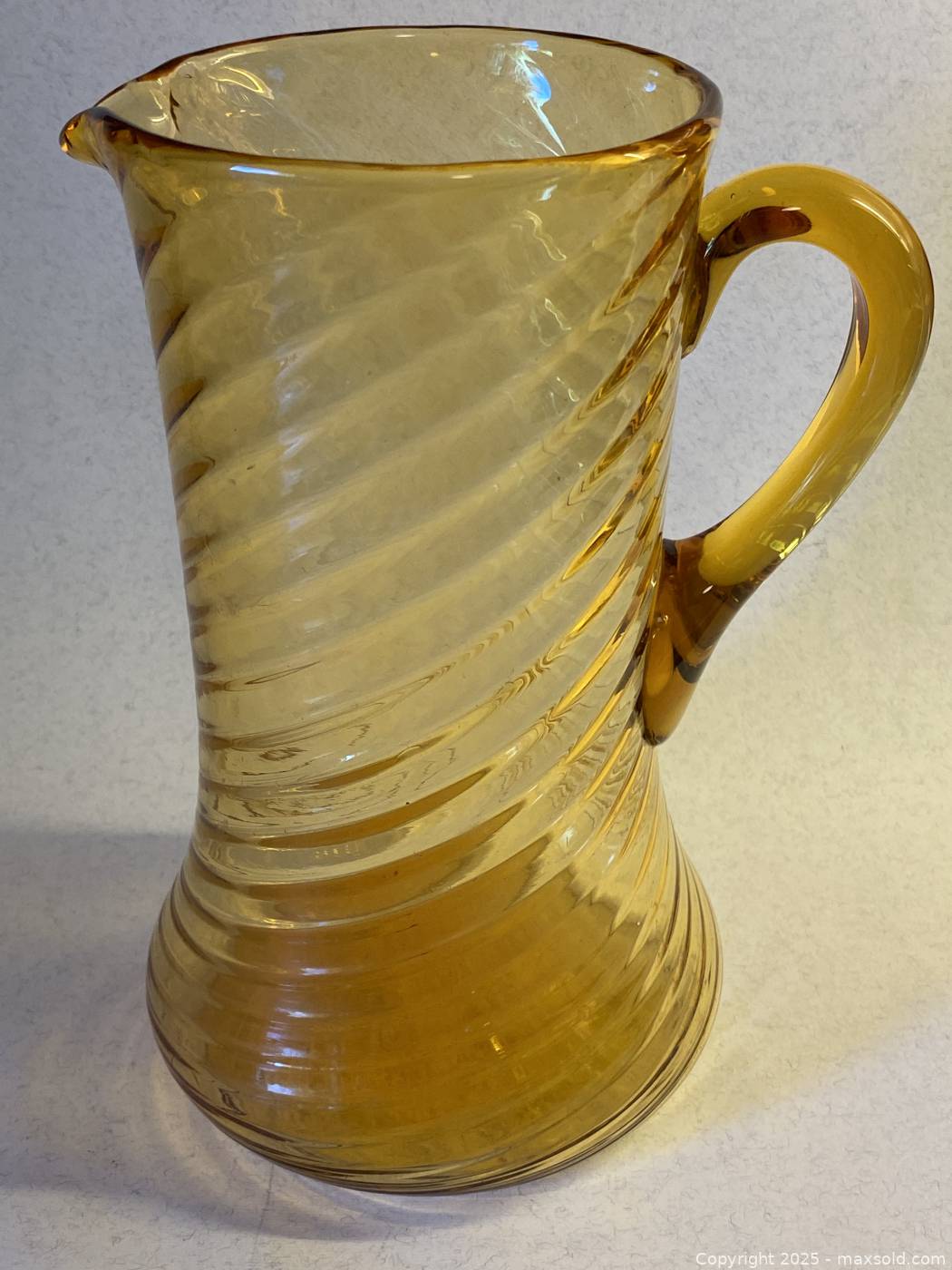 MCM amber swirl glass pitcher | Maxsold