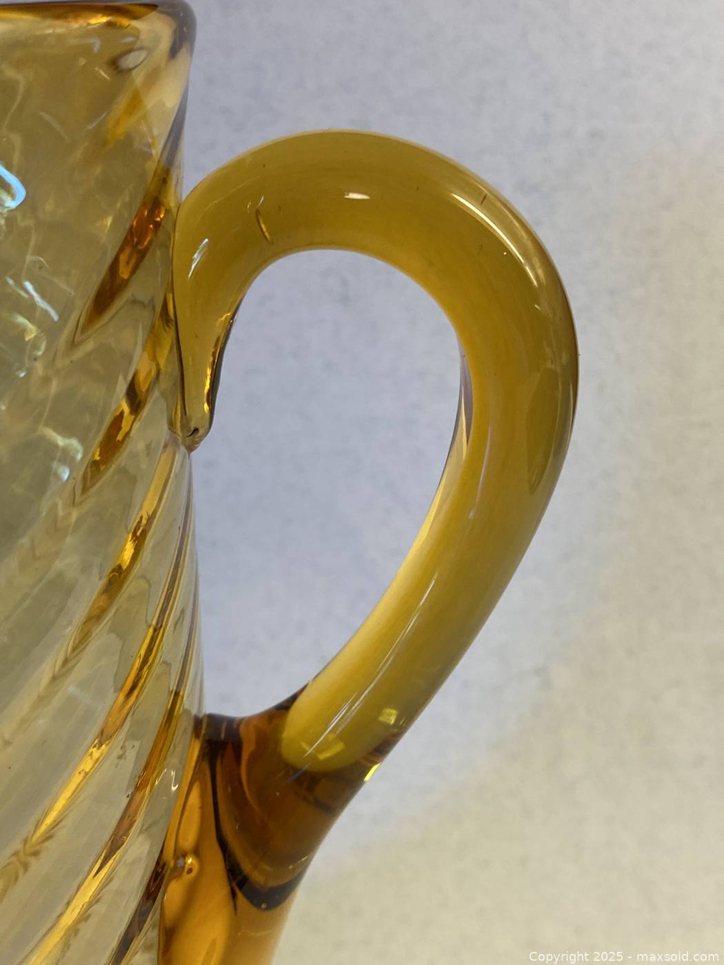 MCM amber swirl glass pitcher | Maxsold