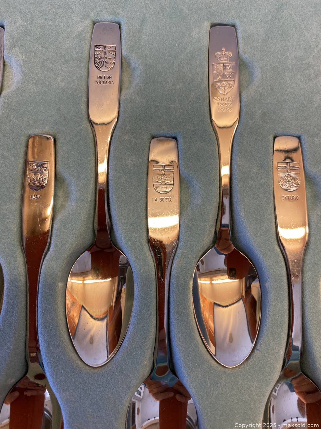 Set of 12 Canada Centennial silver-plated spoons | Maxsold