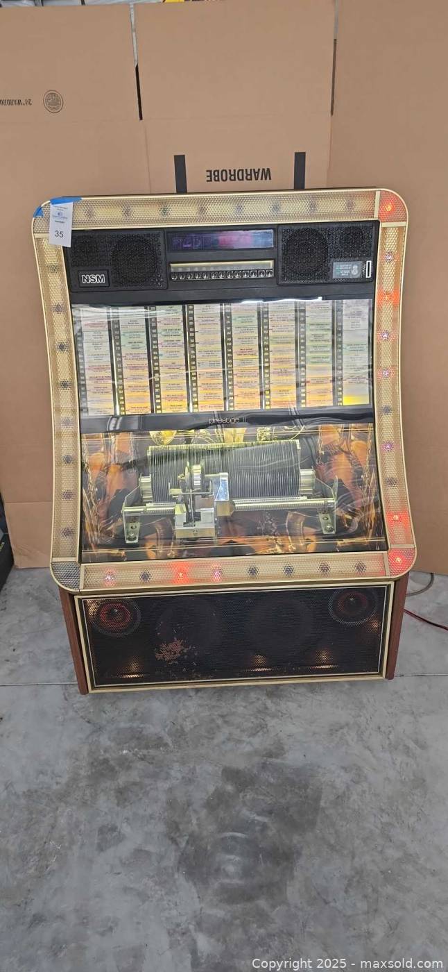 NSM Prestige II 45 RPM vinyl jukebox with approx. 80 records | Maxsold