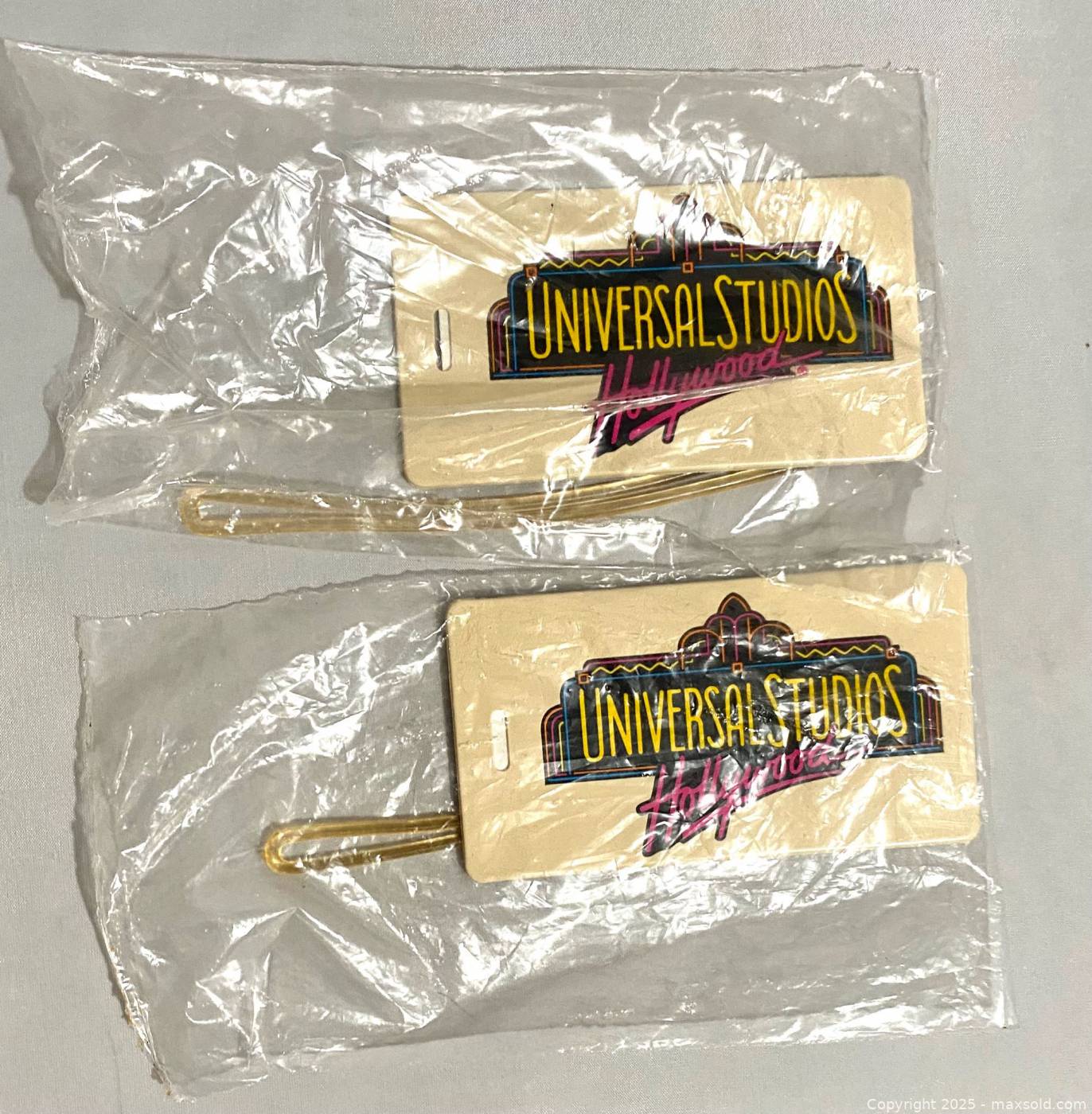 Universal Studios duffel, tags, promo CDs | Maxsold