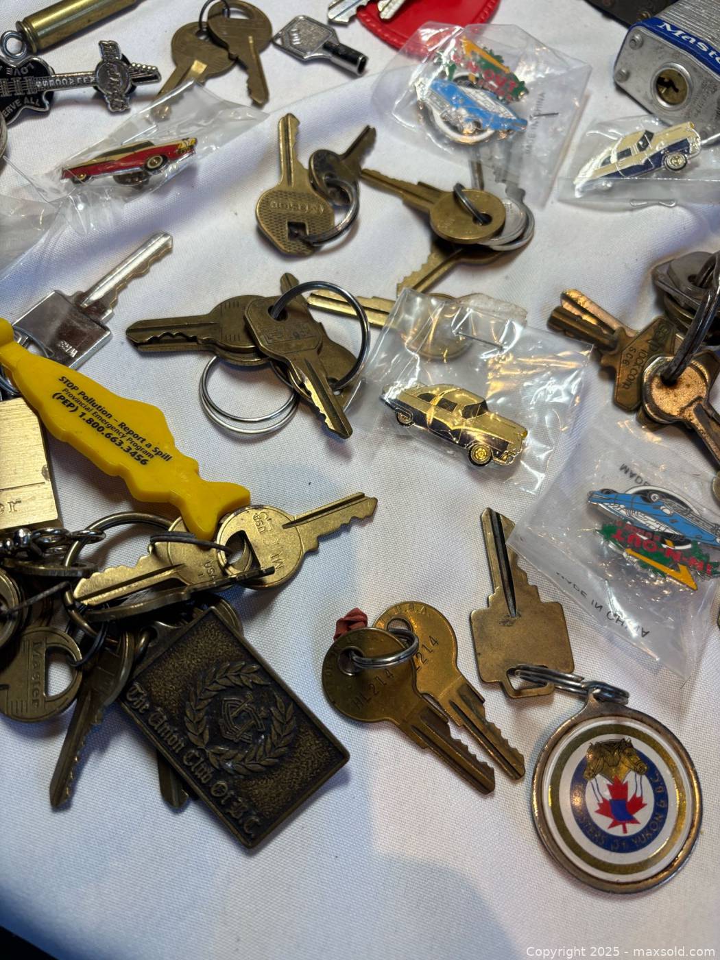 Assorted vintage keys, padlocks, pins, Hudson’s Bay wood box | Maxsold