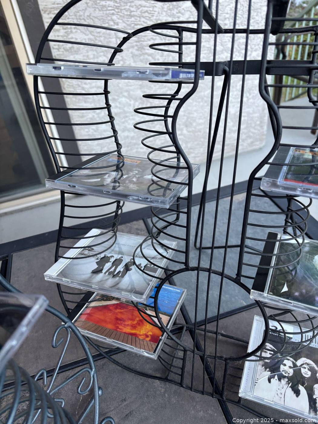 Two wrought iron guitar-shaped CD holders | Maxsold