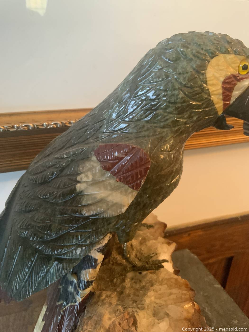 Carved semi-precious stone parrot on amethyst base | Maxsold