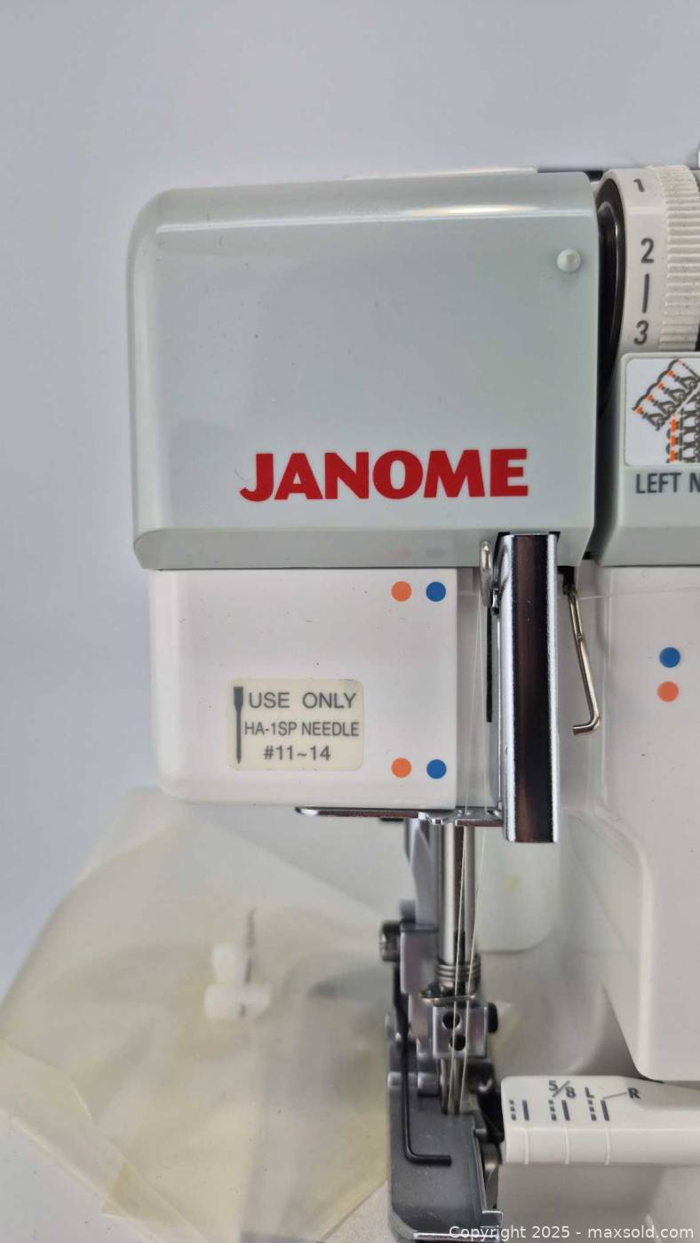 Janome 1110DX Serger Overlock Sewing Machine with Accessories | Maxsold