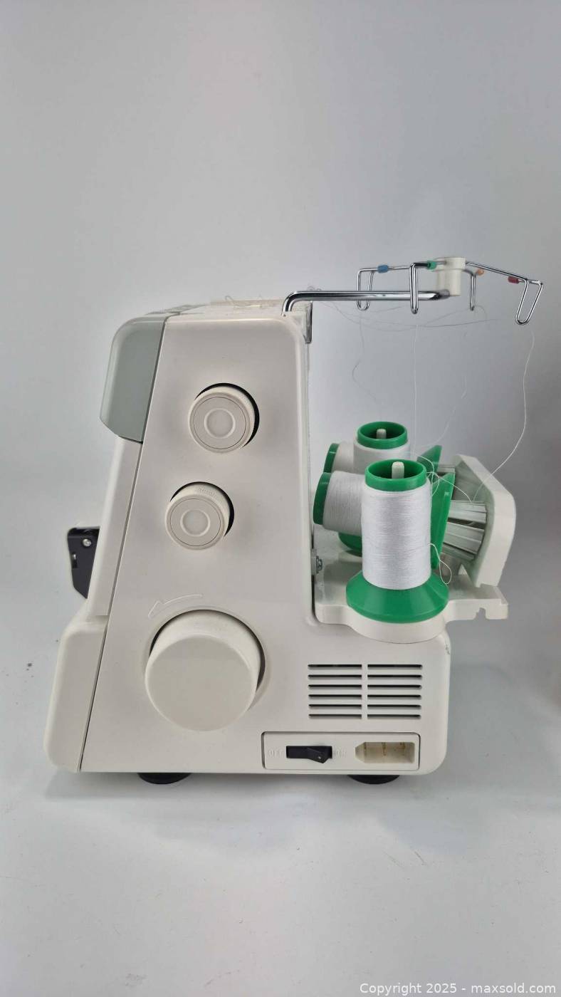 Janome 1110DX Serger Overlock Sewing Machine with Accessories | Maxsold