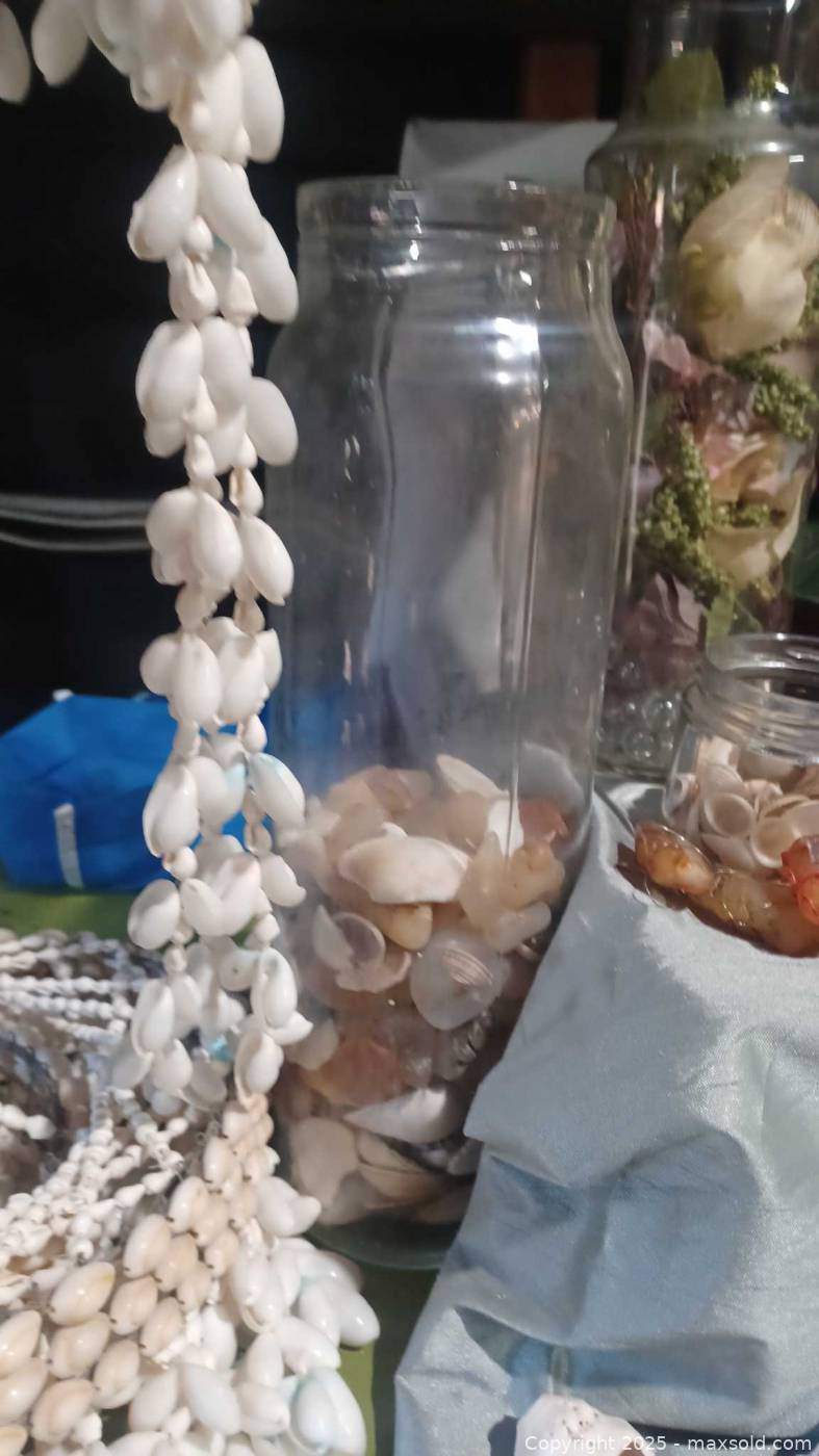 Assorted beach decor, shell chandelier, framed prints, vases, shells ...