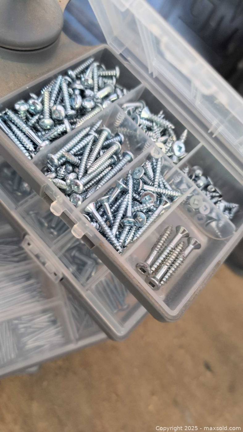 Rotating organizer with assorted fasteners | Maxsold