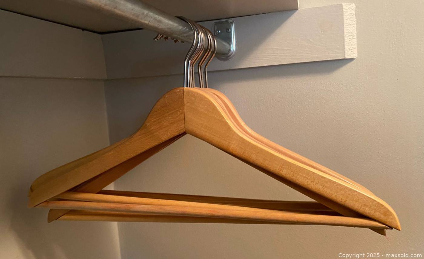 19 wooden clothes hangers | Maxsold