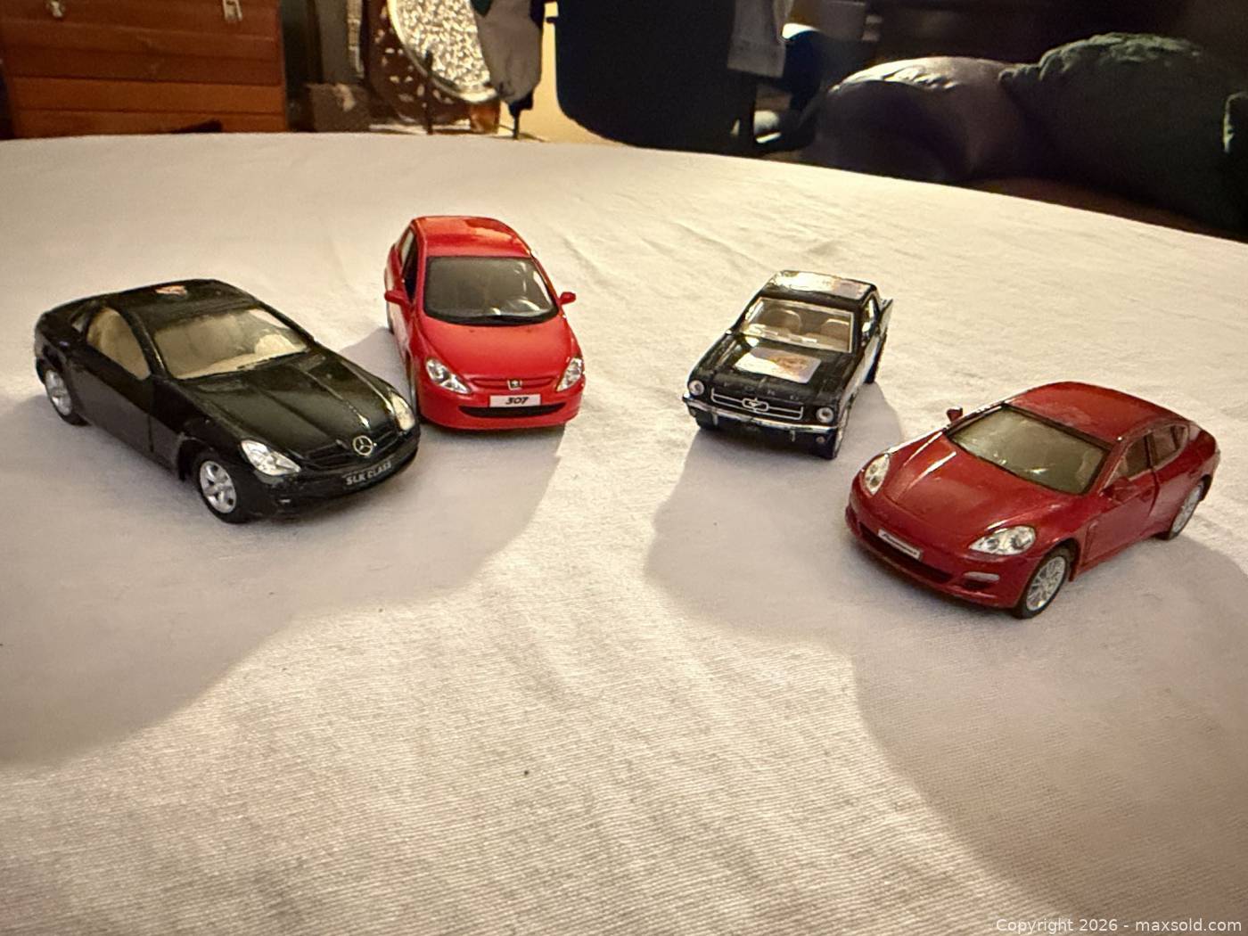 Four die-cast toy vehicles | Maxsold