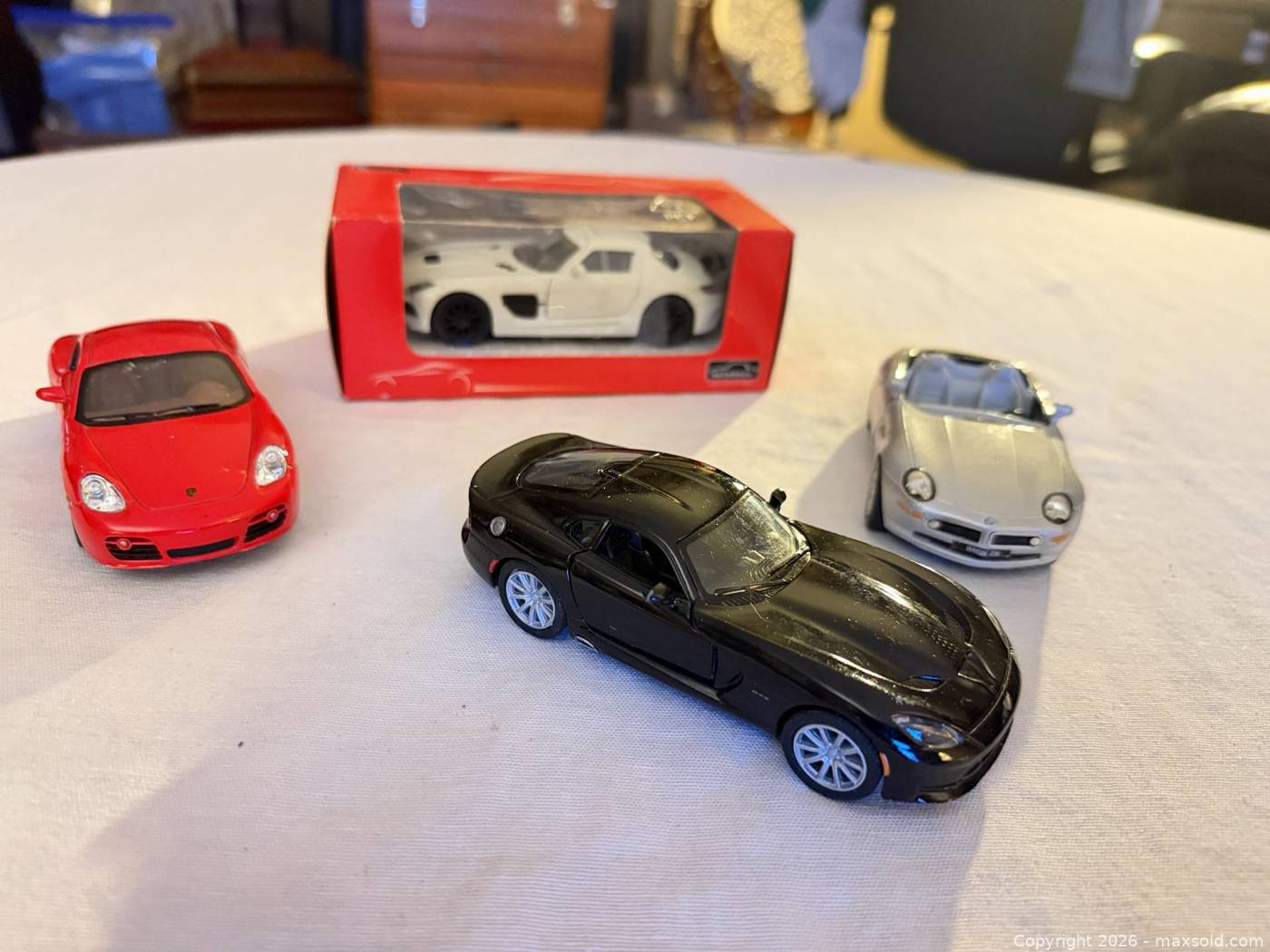 Four die-cast toy sports cars | Maxsold