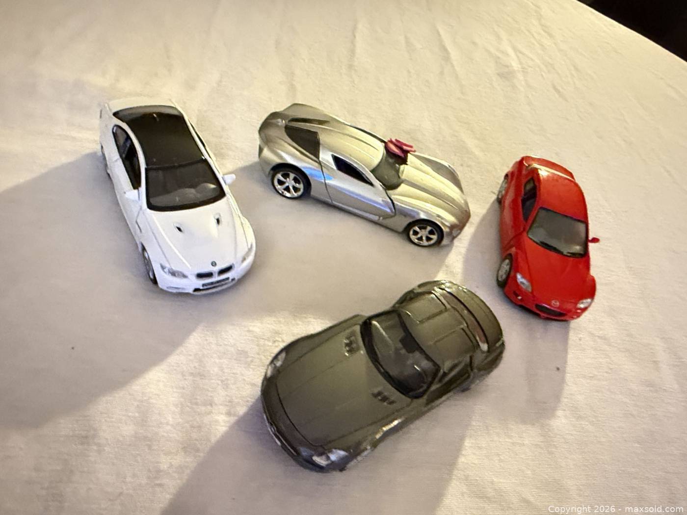 4 toy sports car vehicles | Maxsold