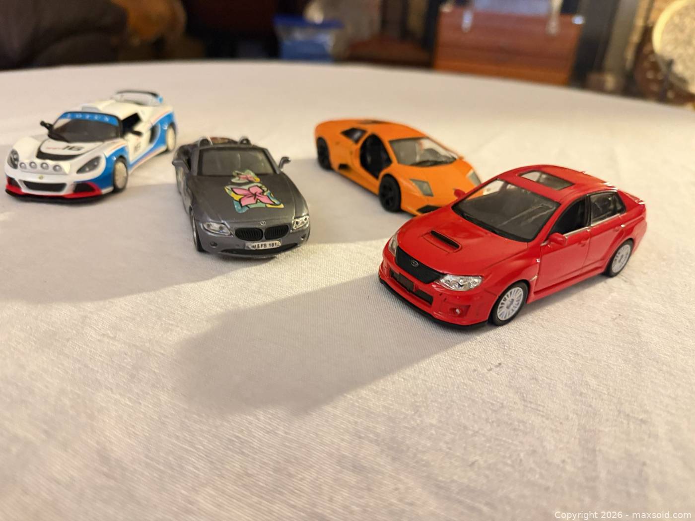 Lot of 4 toy sports cars | Maxsold