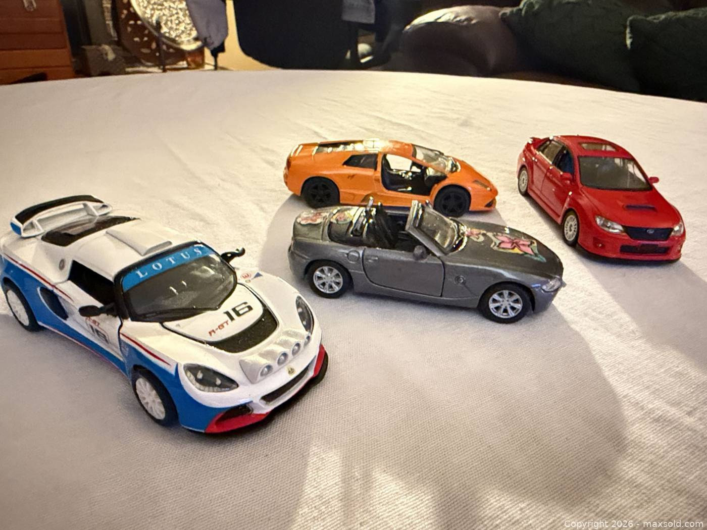 Lot of 4 toy sports cars | Maxsold