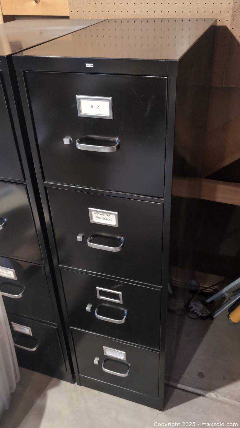 Black metal 4-drawer vertical file cabinet | Maxsold