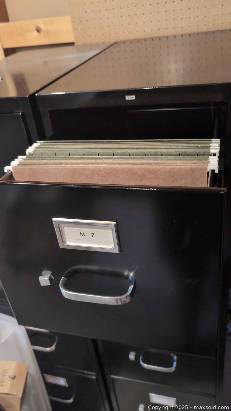 Black metal 4-drawer vertical file cabinet | Maxsold