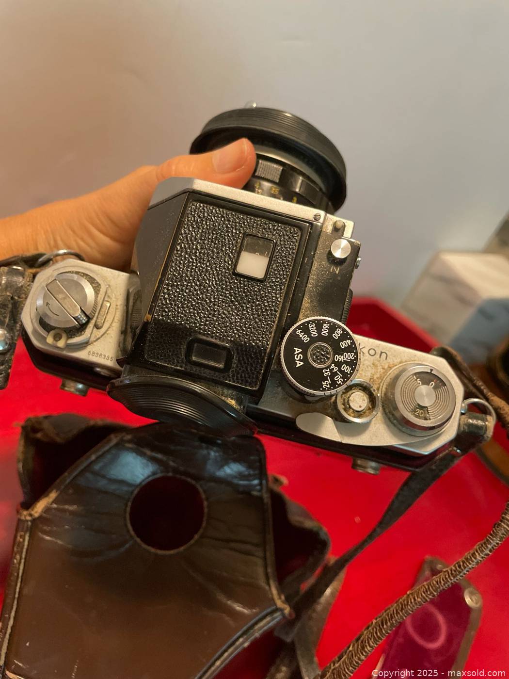 Nikon F 35mm SLR film camera, lens, leather case | Maxsold